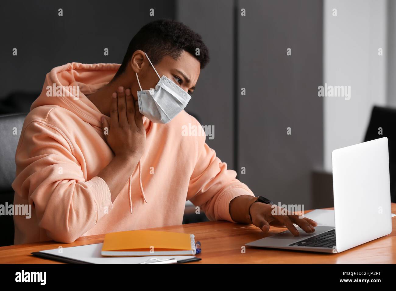 Ill African-American student in medical mask at home Stock Photo - Alamy