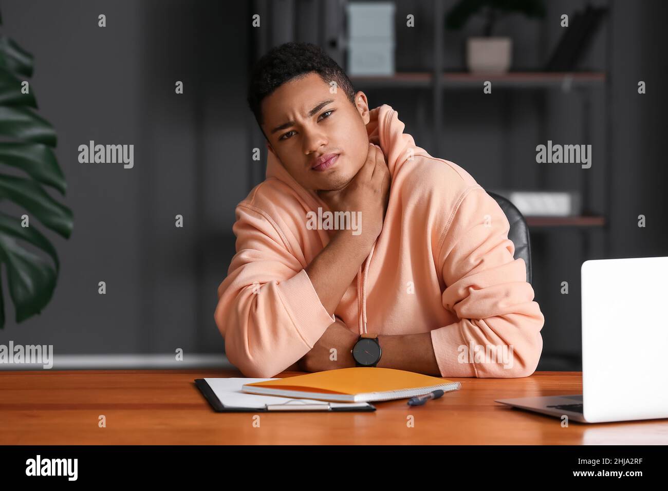 Ill African-American student with sore throat at home Stock Photo - Alamy