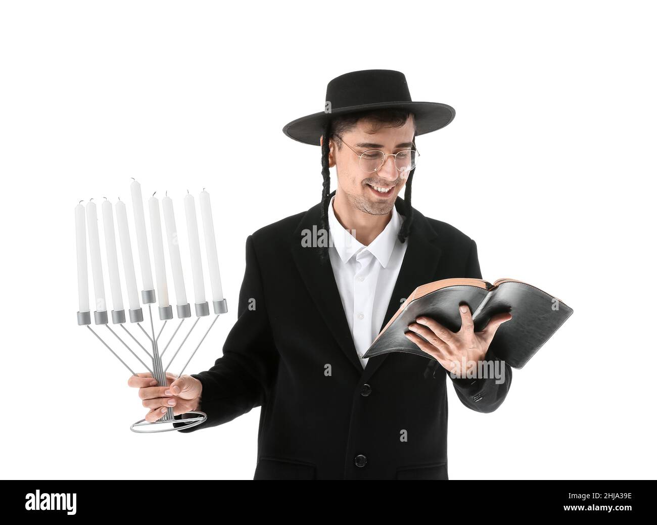 Jewish man with Torah and menorah on white background Stock Photo - Alamy