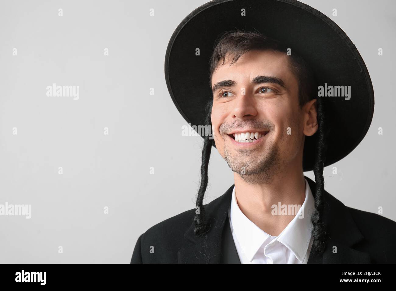 Hasidic Jewish man on light background Stock Photo - Alamy