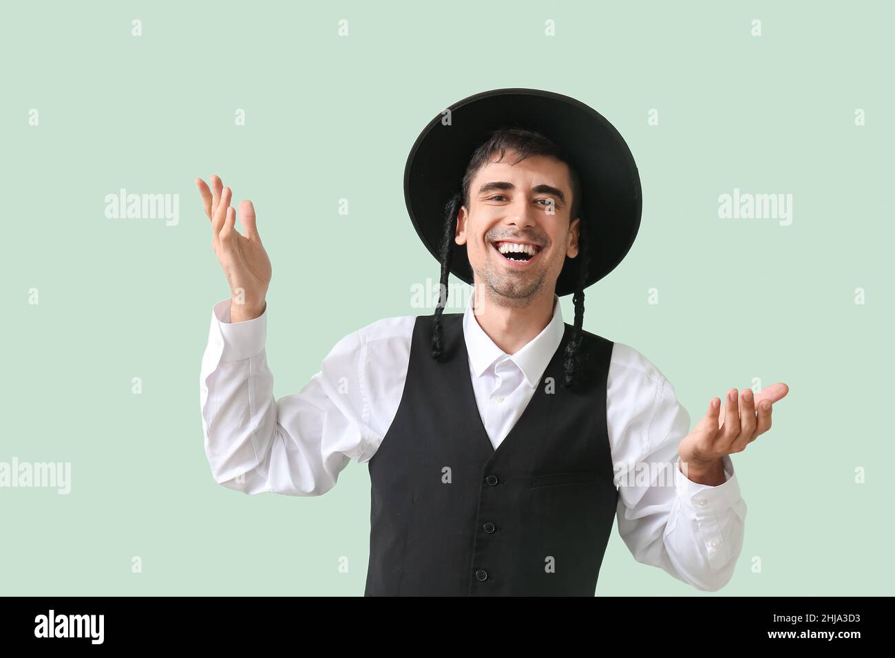 Happy Hasidic Jewish man on color background Stock Photo - Alamy