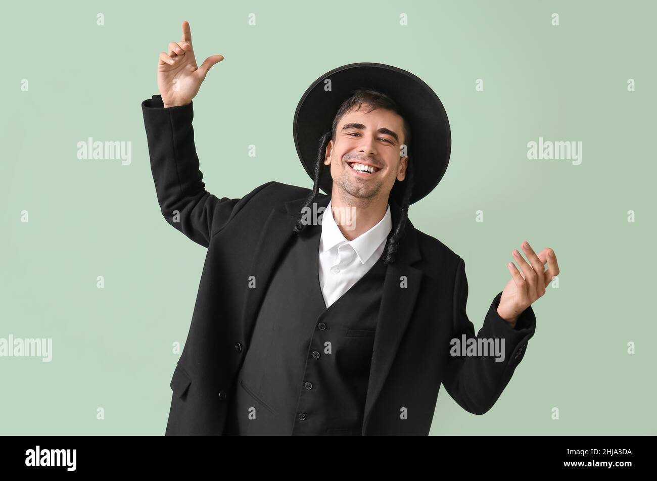 Happy Hasidic Jewish man on color background Stock Photo - Alamy