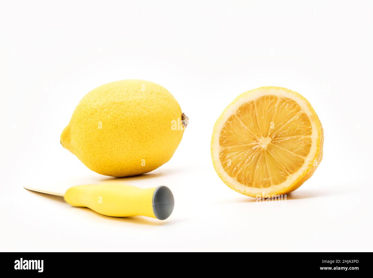Lemons on white background. Halfs of lemon and whole lemon, with little ...