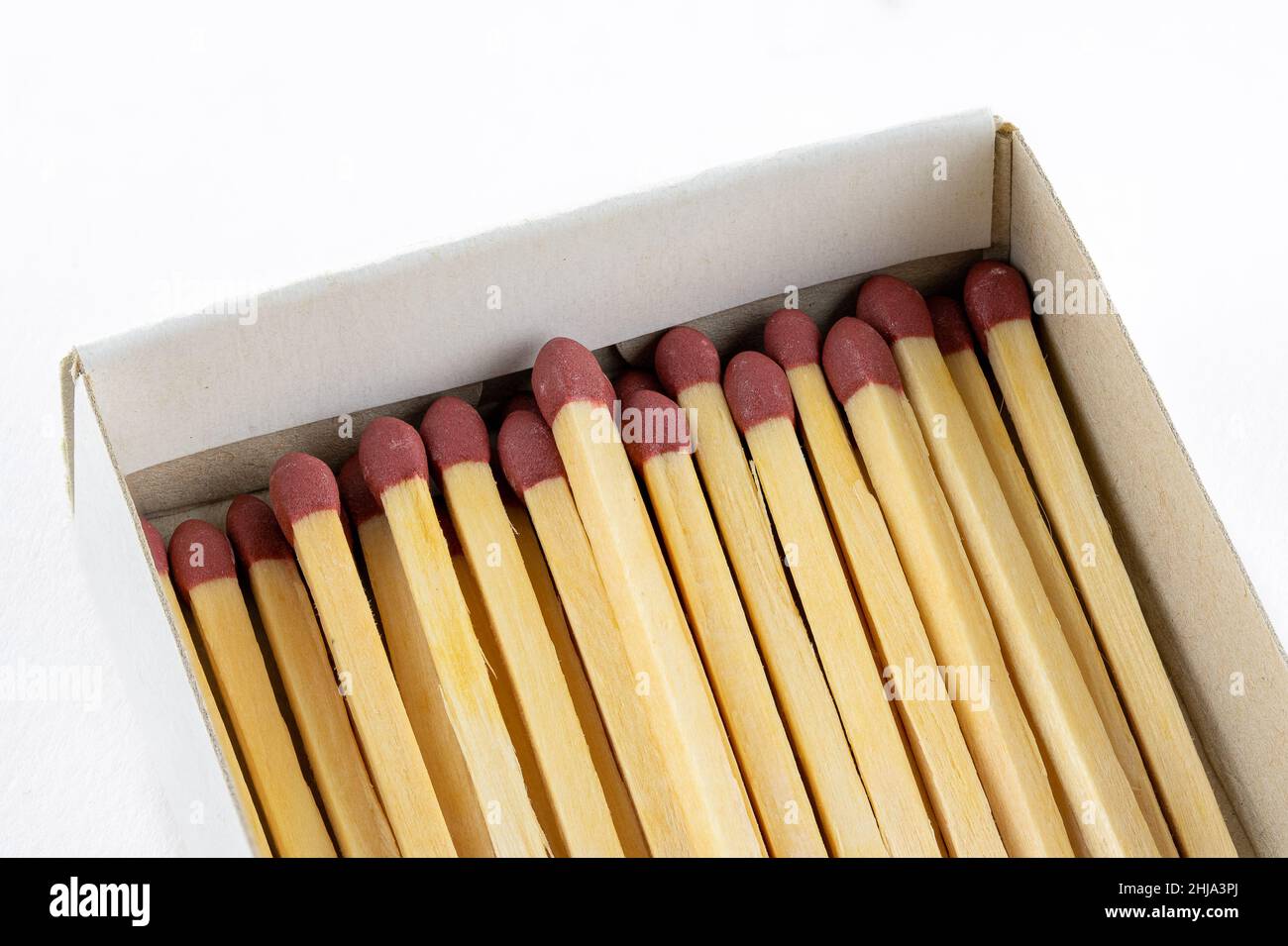 Match sticks in a box on a white background Stock Photo - Alamy