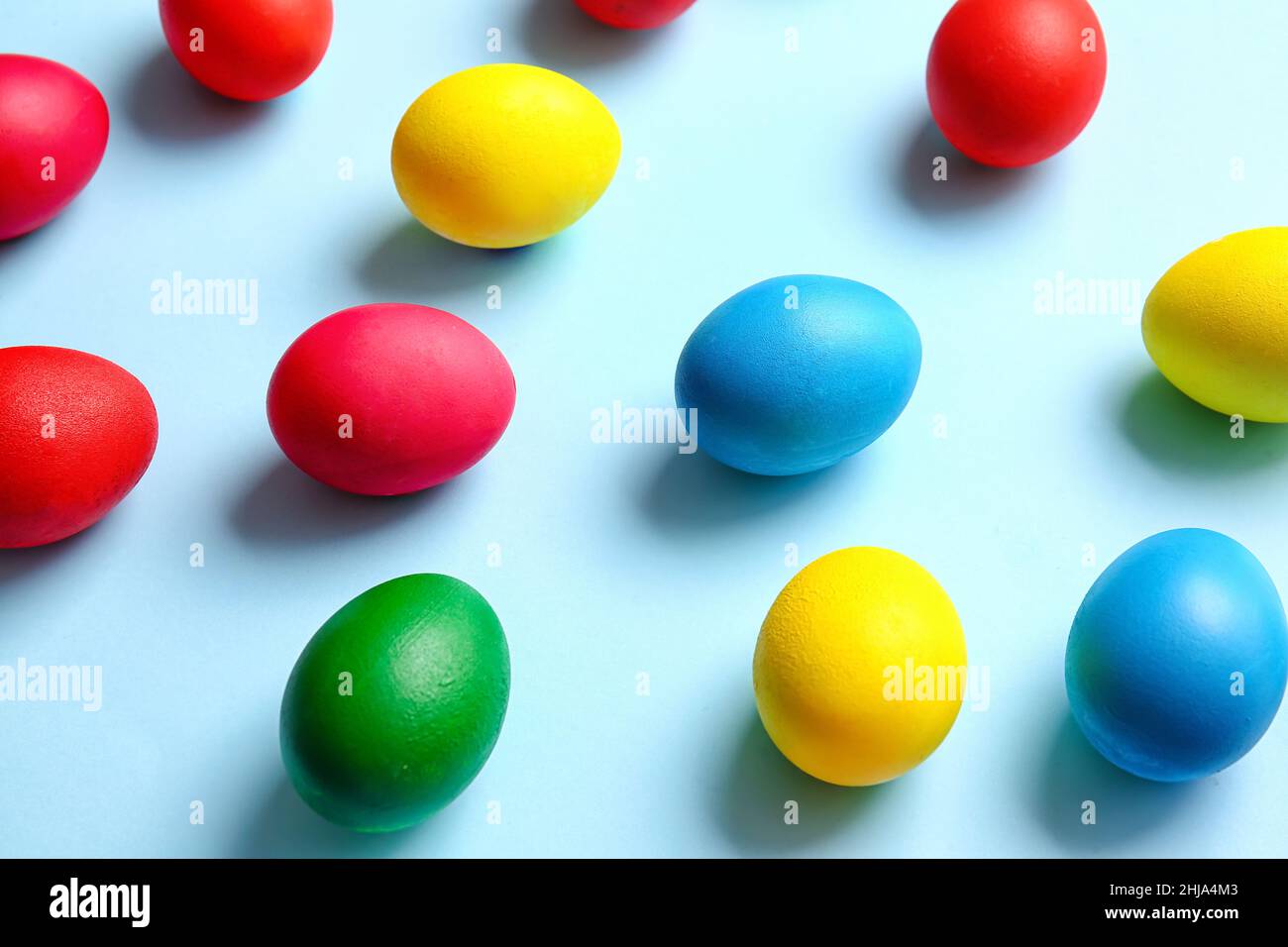 Multicolored Easter eggs on color background Stock Photo - Alamy