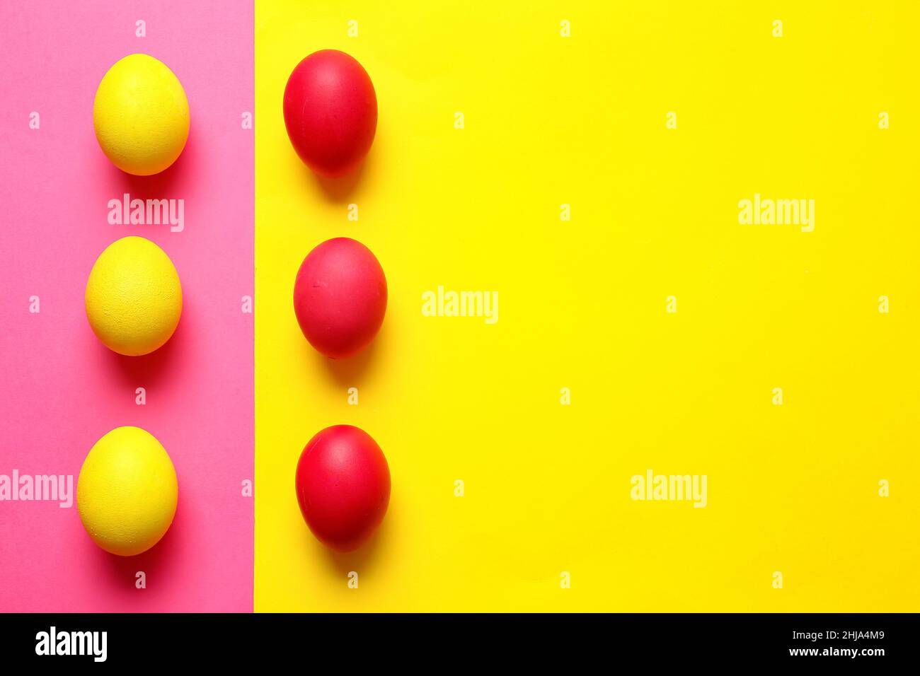 Red and yellow Easter eggs on color background Stock Photo - Alamy
