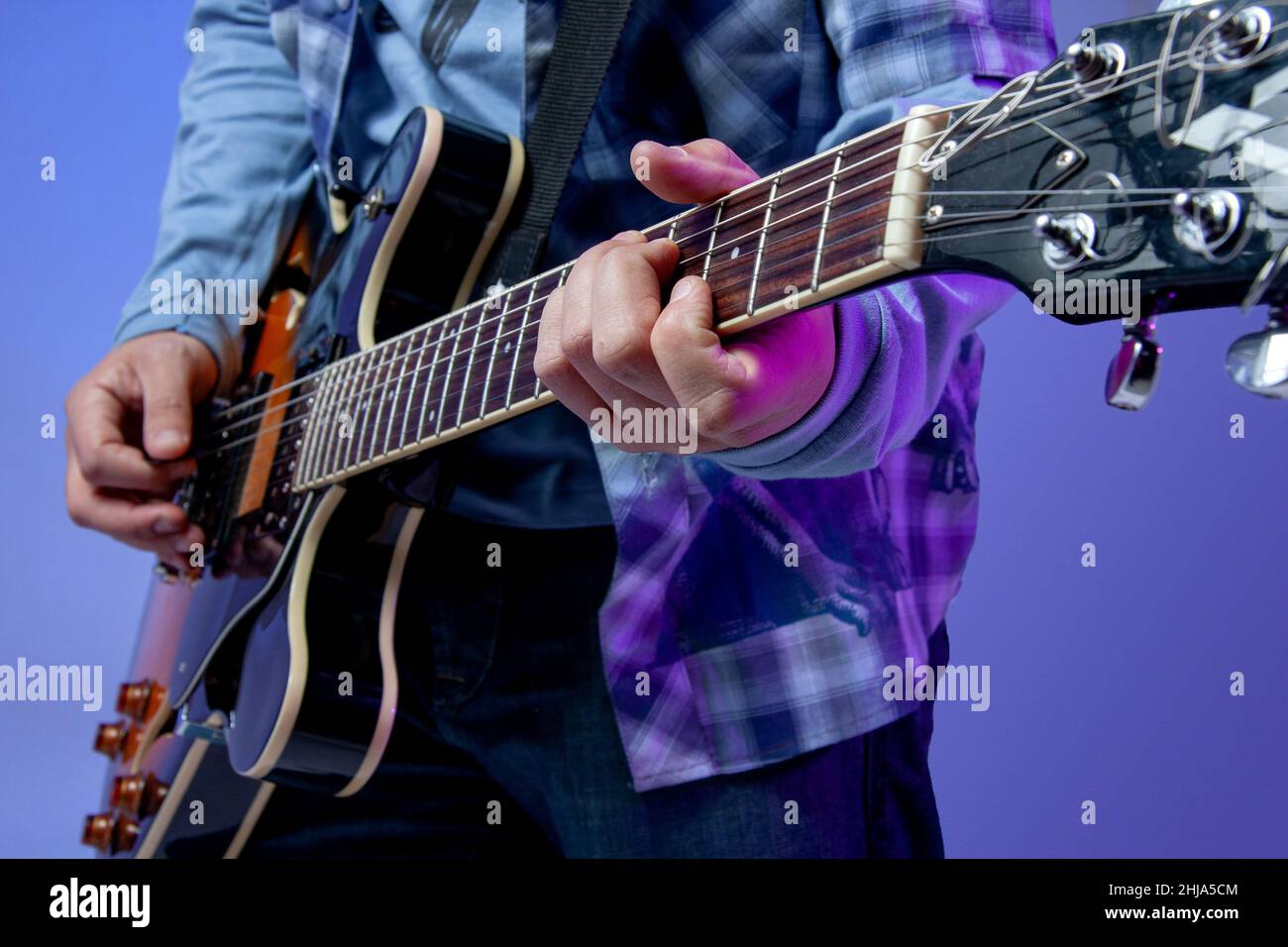 Photo of a guitarist performing on stage Stock Photo - Alamy