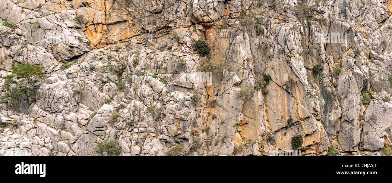 landscape, natural texture - sheer mountain cliff with cracks and ...
