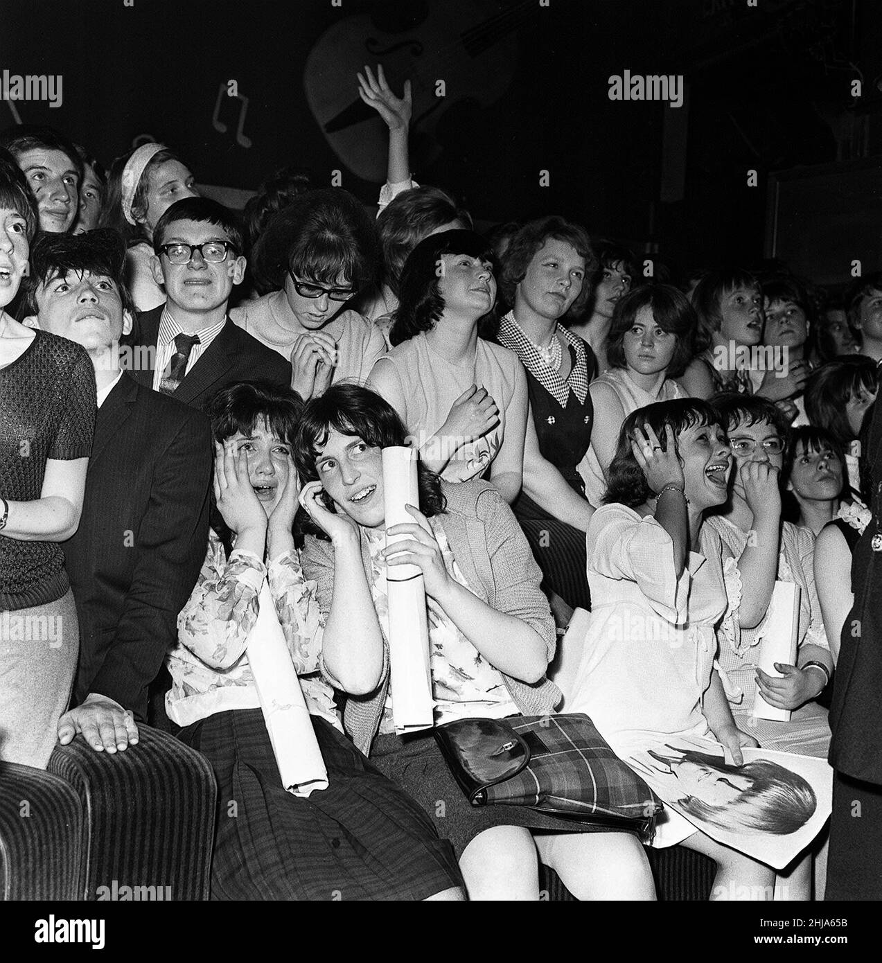 The Rolling Stones. Fans scream as the Stones perform on stage at the ...