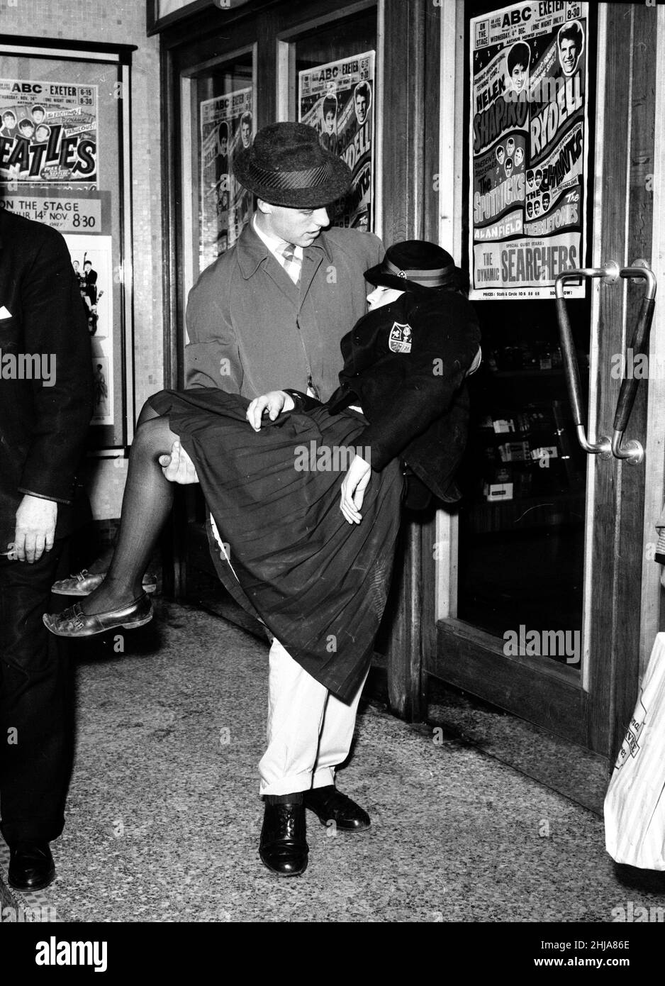 A Female Beatles Fan is carried out at a concert in Exeter.14th ...
