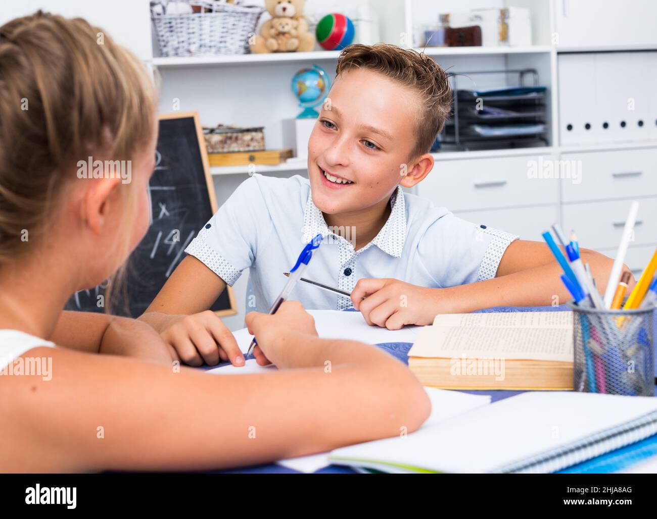 Brother with sister are doing homework Stock Photo - Alamy