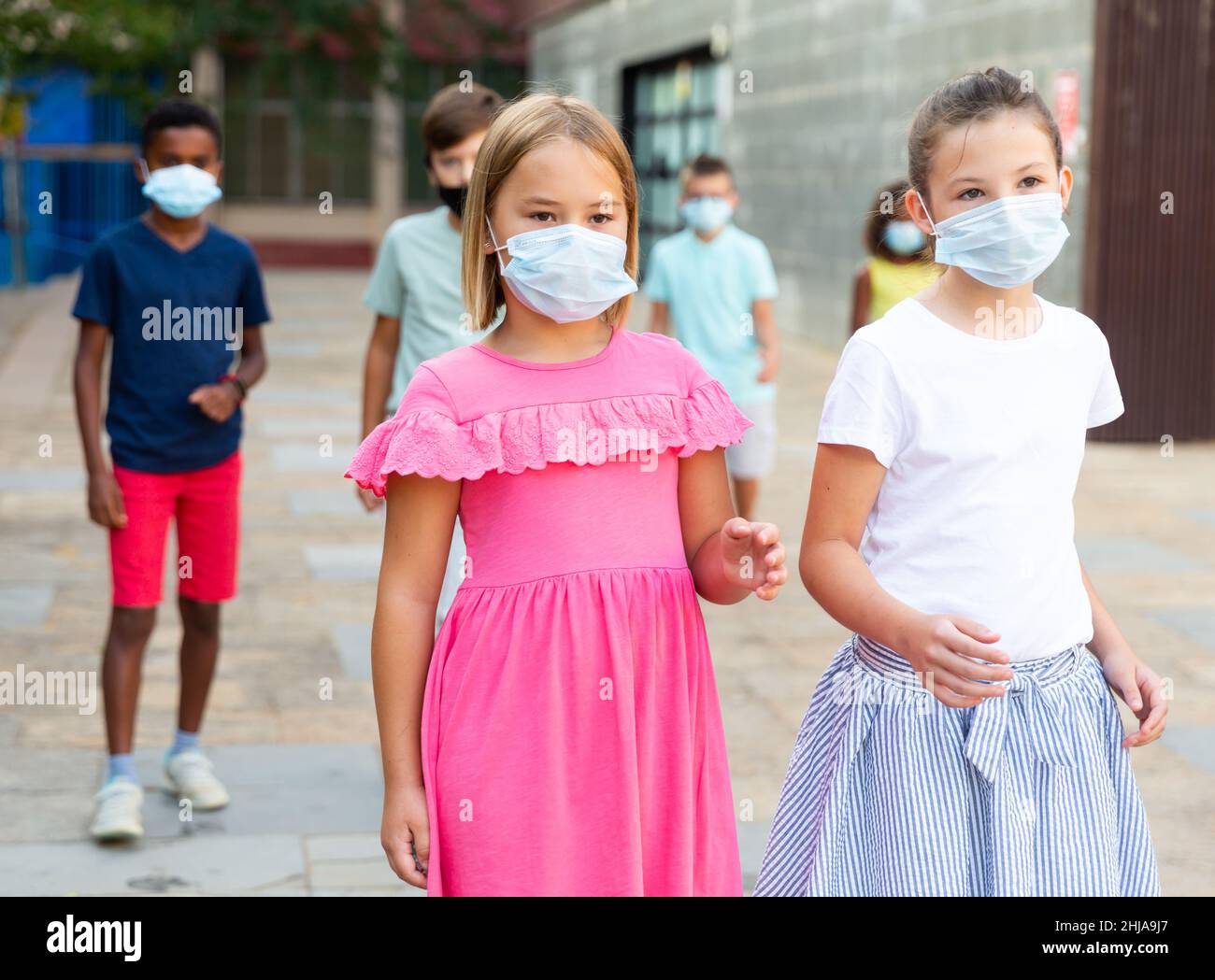 Kids walking together outdoors Stock Photo - Alamy
