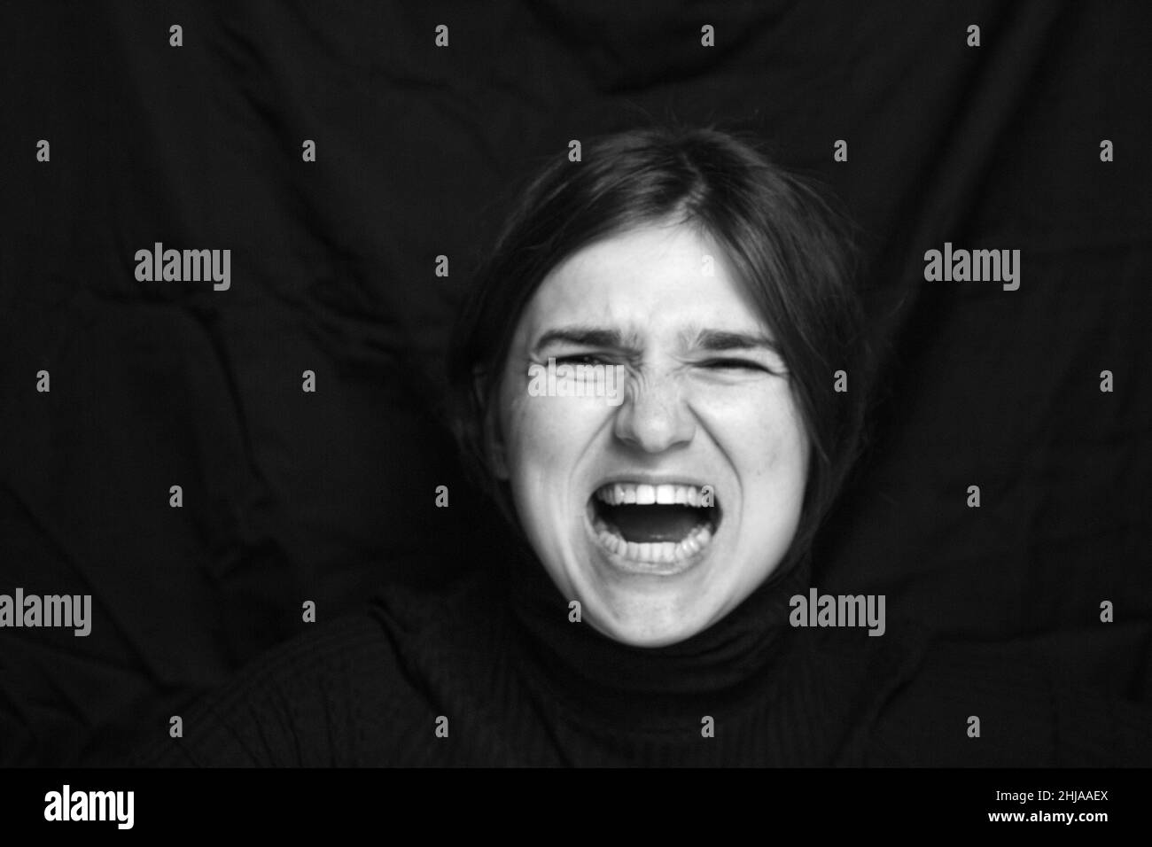 Young woman screaming, hate, rage. Crying emotional angry woman ...