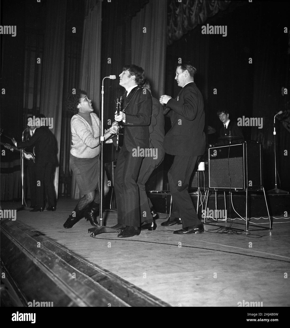 A female fans gets onto the stage with The Beatles at Stockton.22nd ...