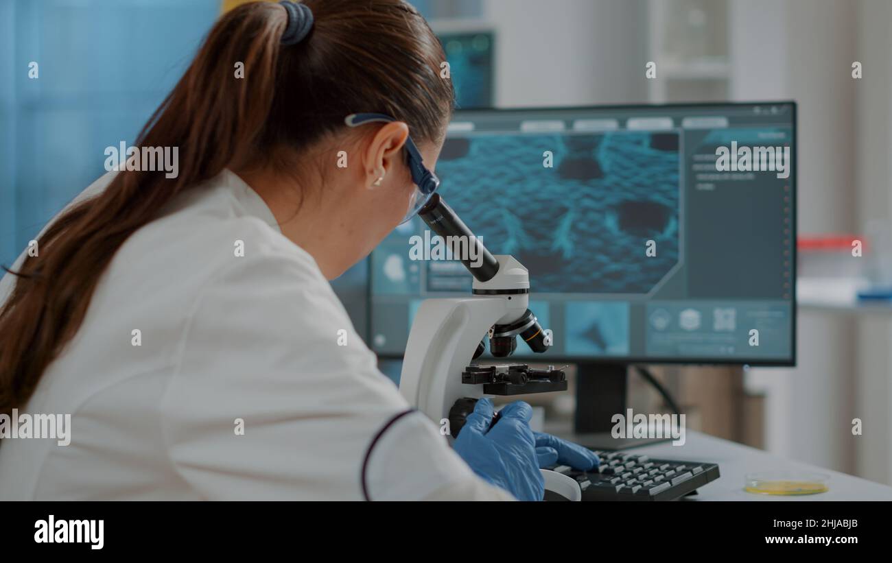 Biology scientist working with microscopic tool in laboratory ...