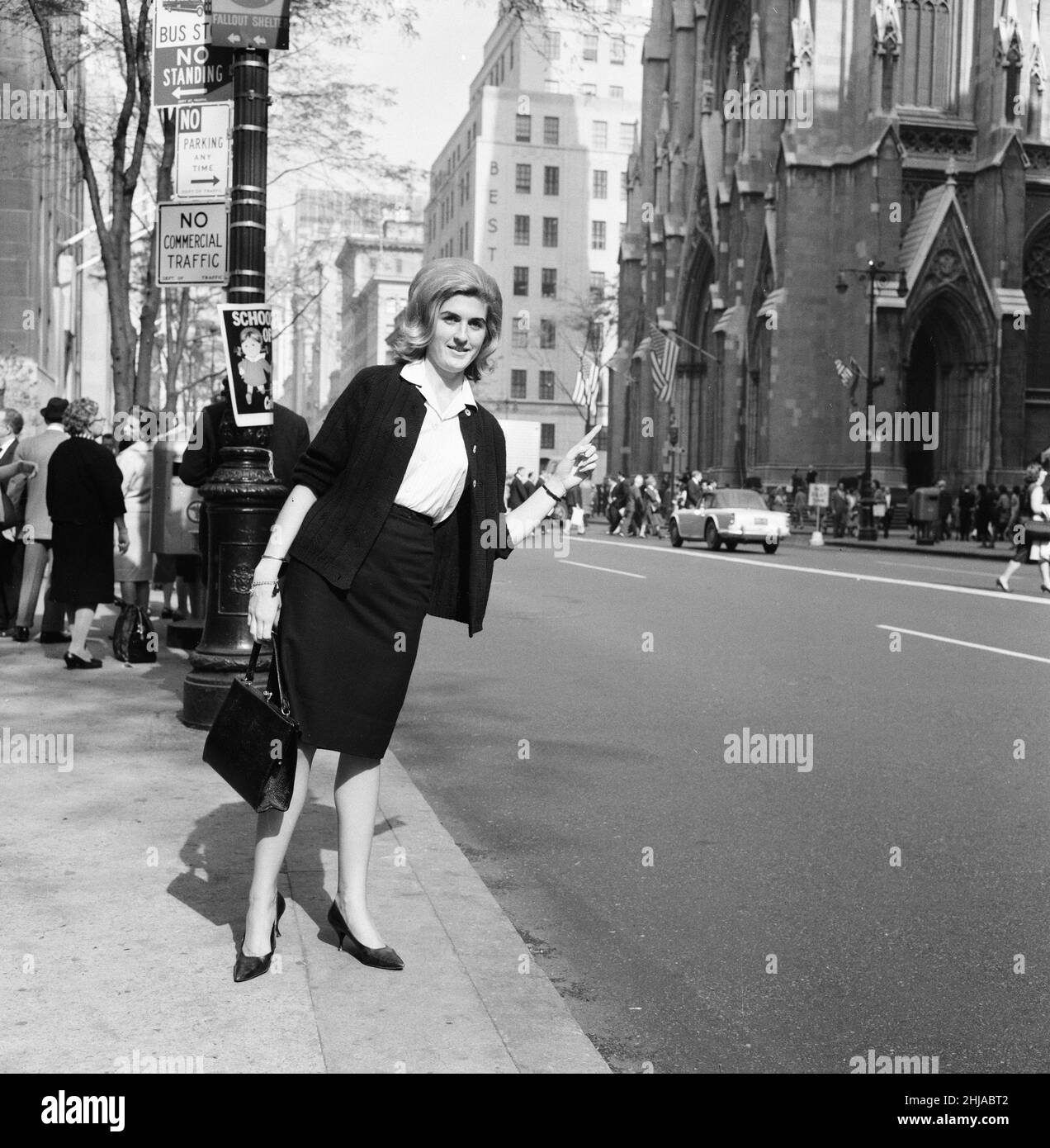 Woman hailing a bus to stop Black and White Stock Photos & Images - Alamy