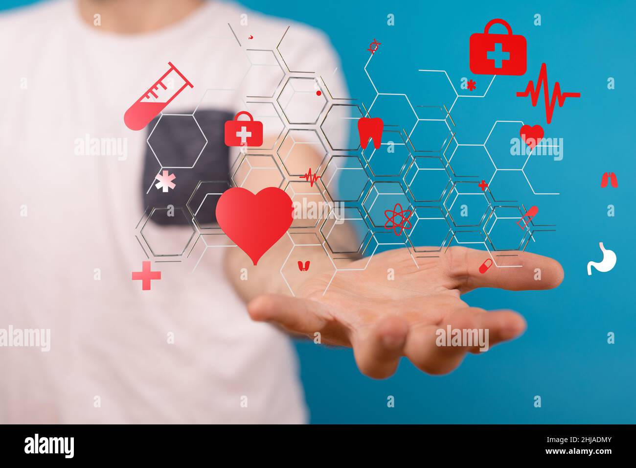 Hand holding a digital render of a network of health symbols Stock ...