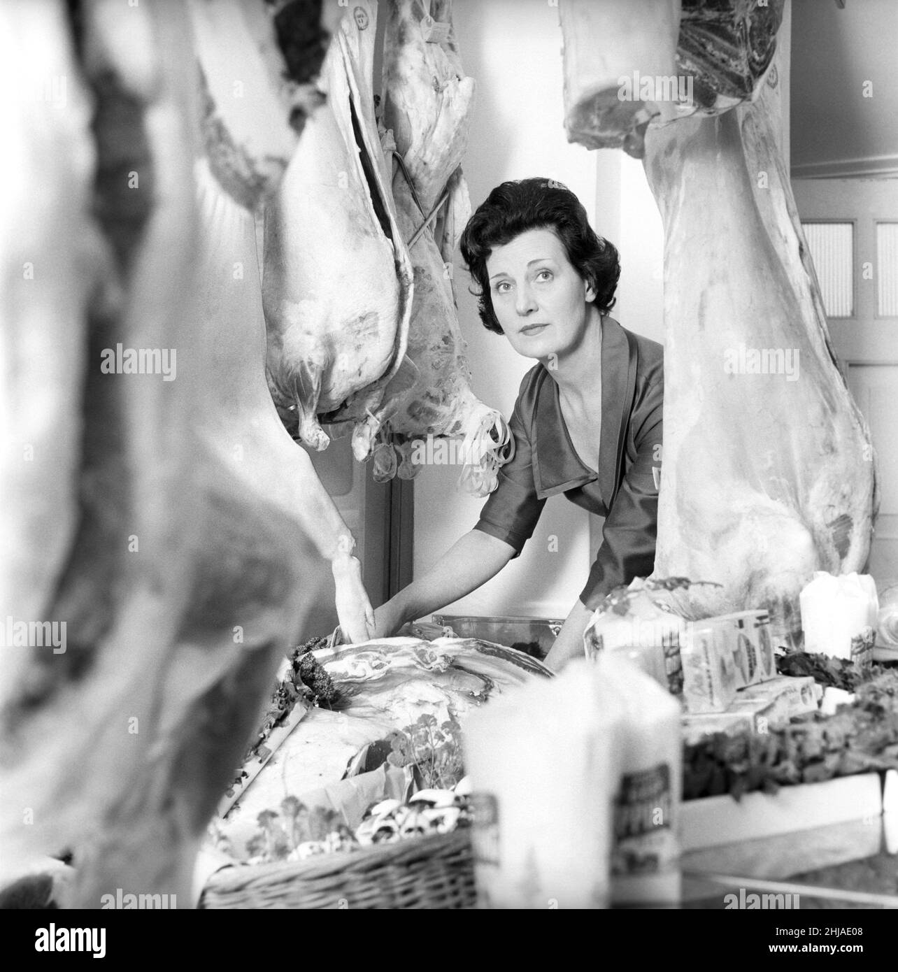 A female butcher seen here at work in her shop. 1963 Stock Photo - Alamy