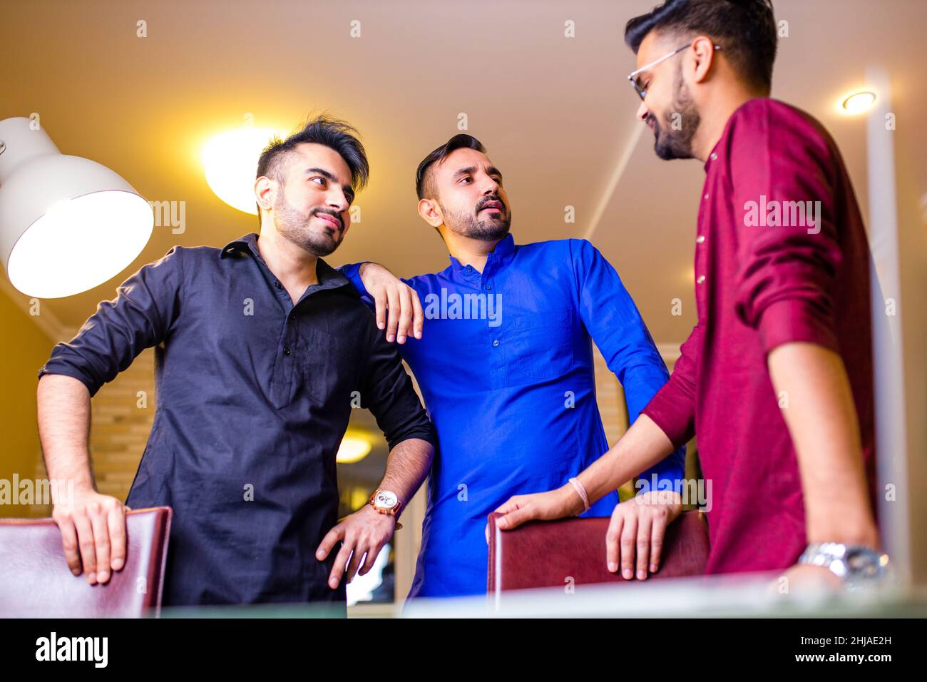indian people talking in living room in evening meeting Stock Photo - Alamy