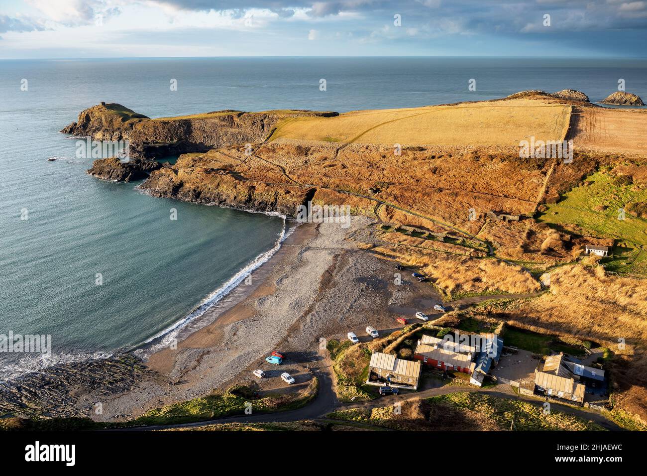 Aerial view of the Welsh seaside village of Abereiddy in a sunny ...