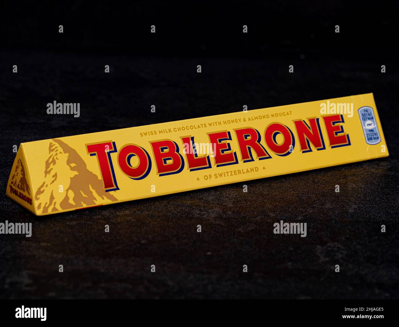 In this photo illustration Toblerone chocolate seen displayed on black ...