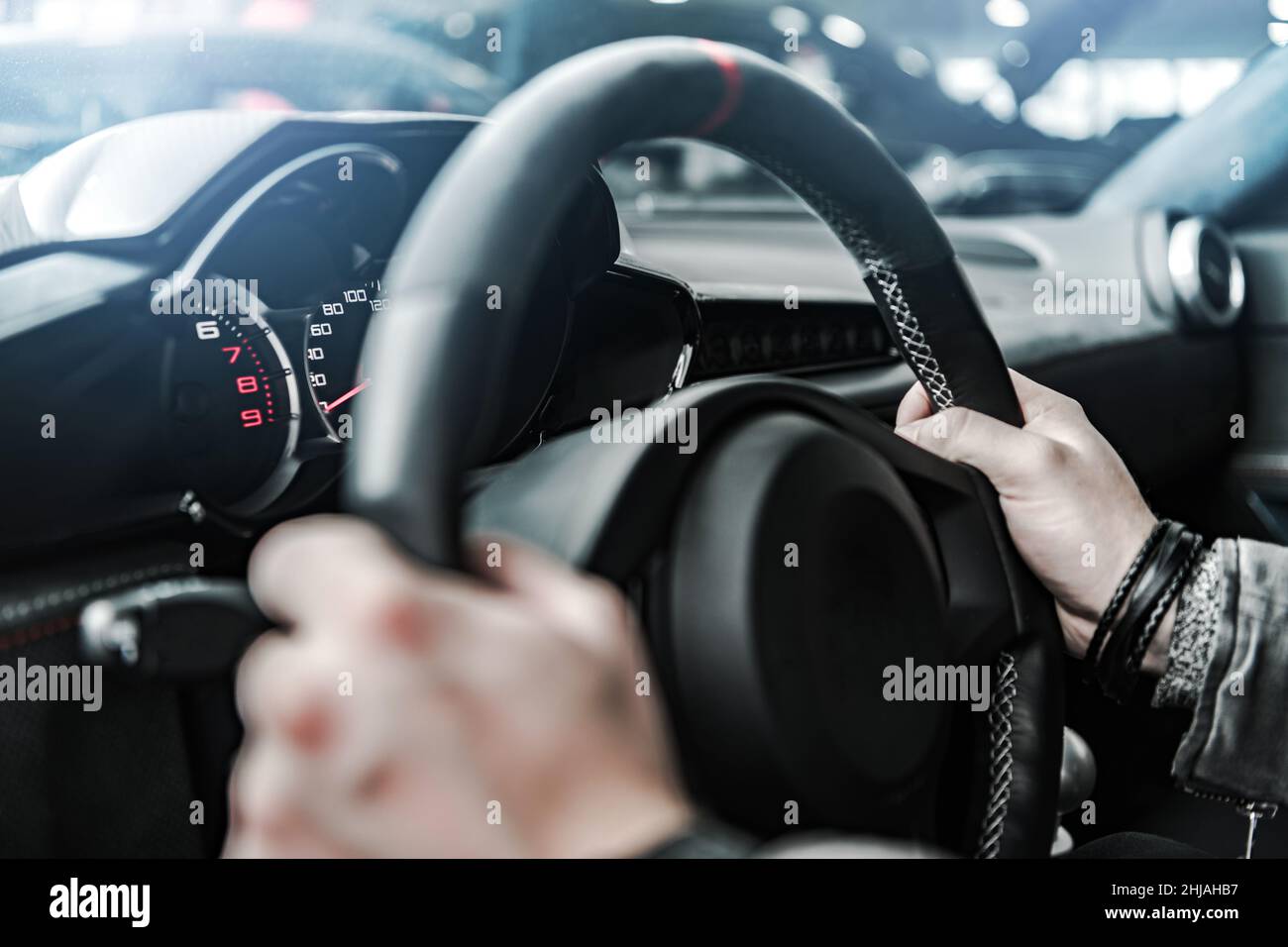 Performance Vehicle Caucasian Driver. Hands on the Steering Wheel ...