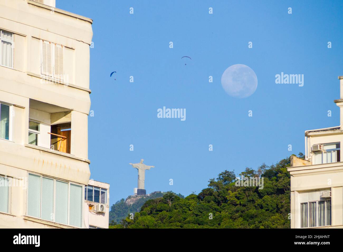 Christ the Redeemer and the Moon seen from Copacabana in Rio de Janeiro ...