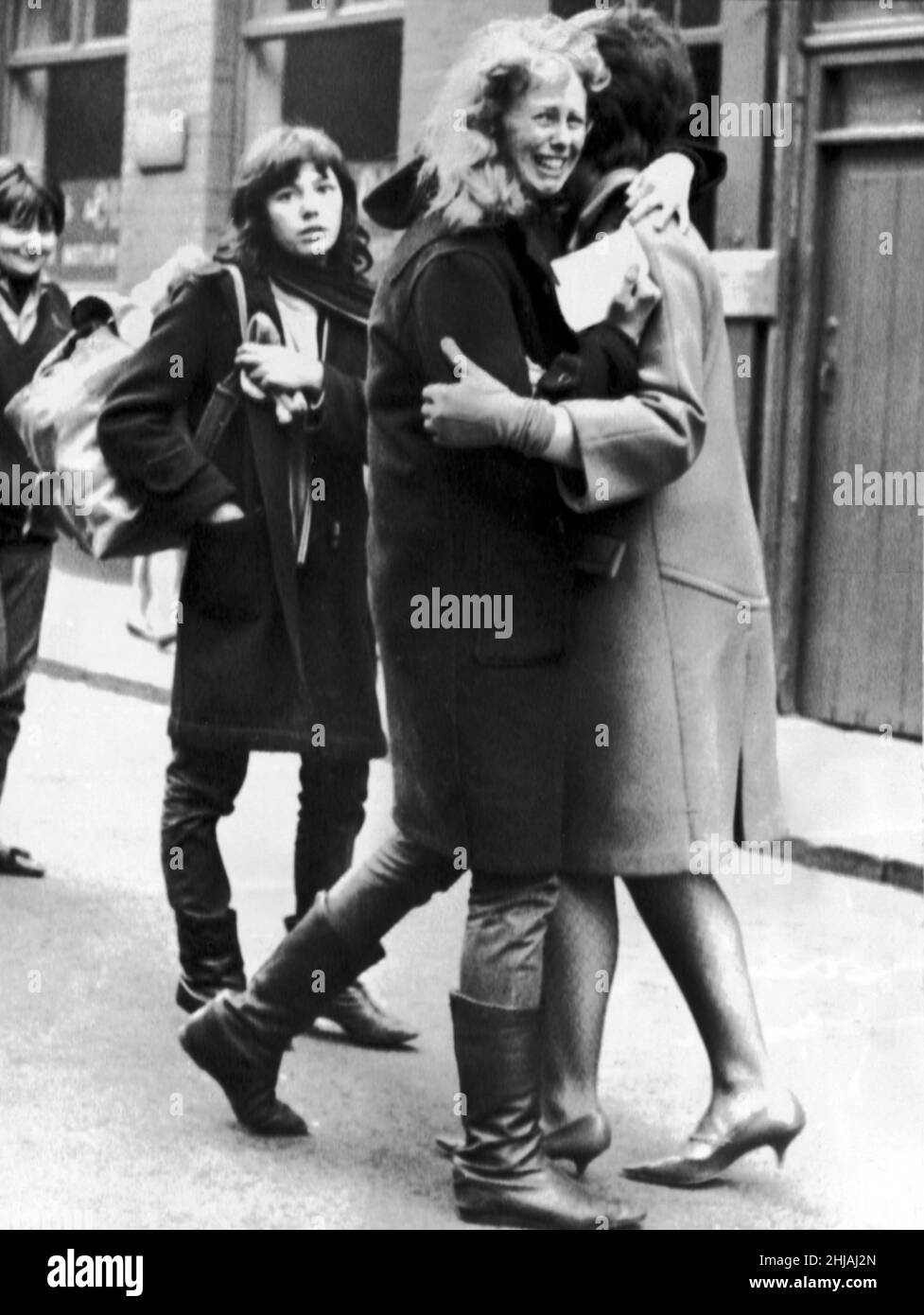 Beatles Fans, two girls hug each other, and one weeps with joy, because ...