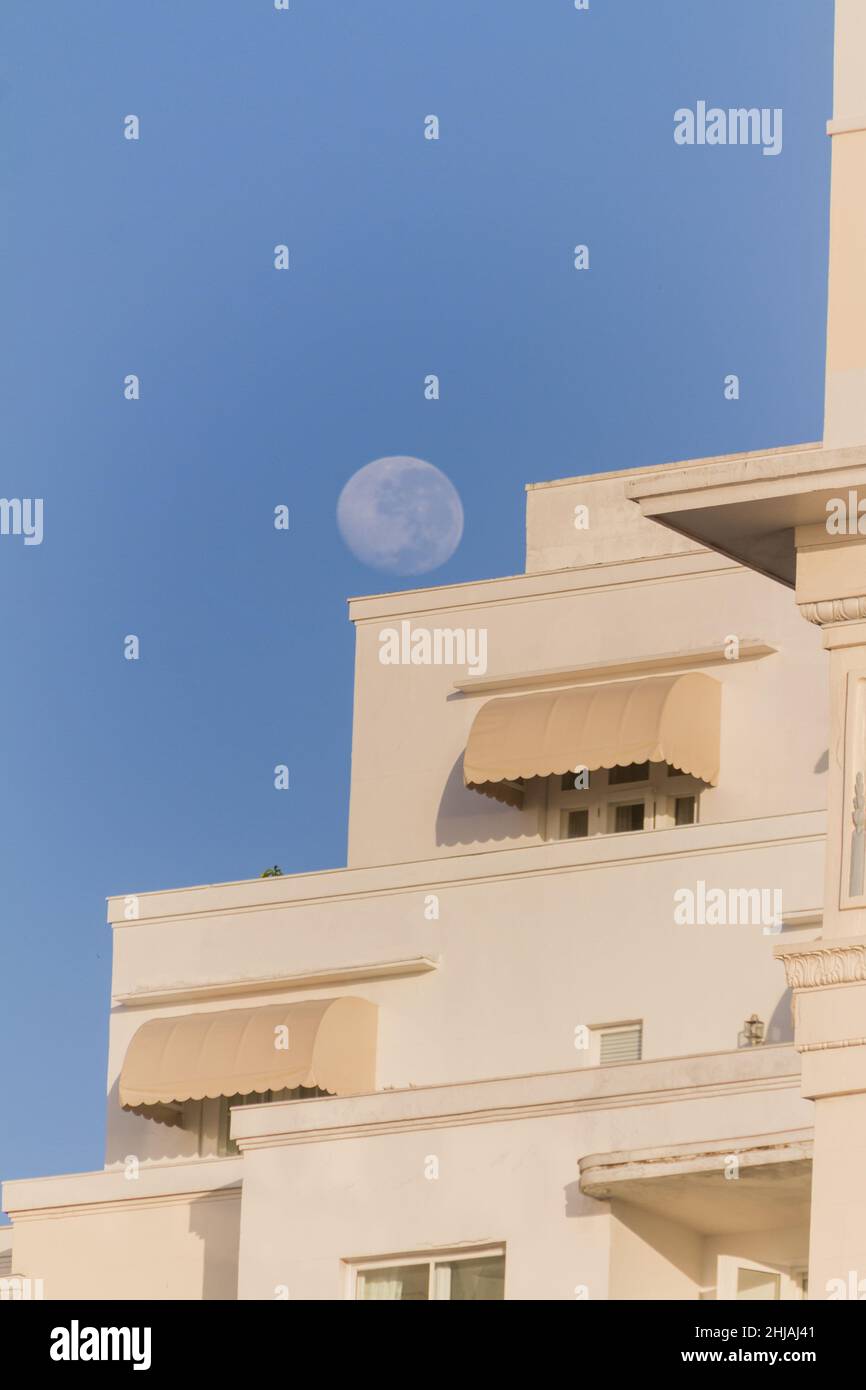 moonset in a beautiful blue sky in the neighborhood of Copacabana, Rio ...