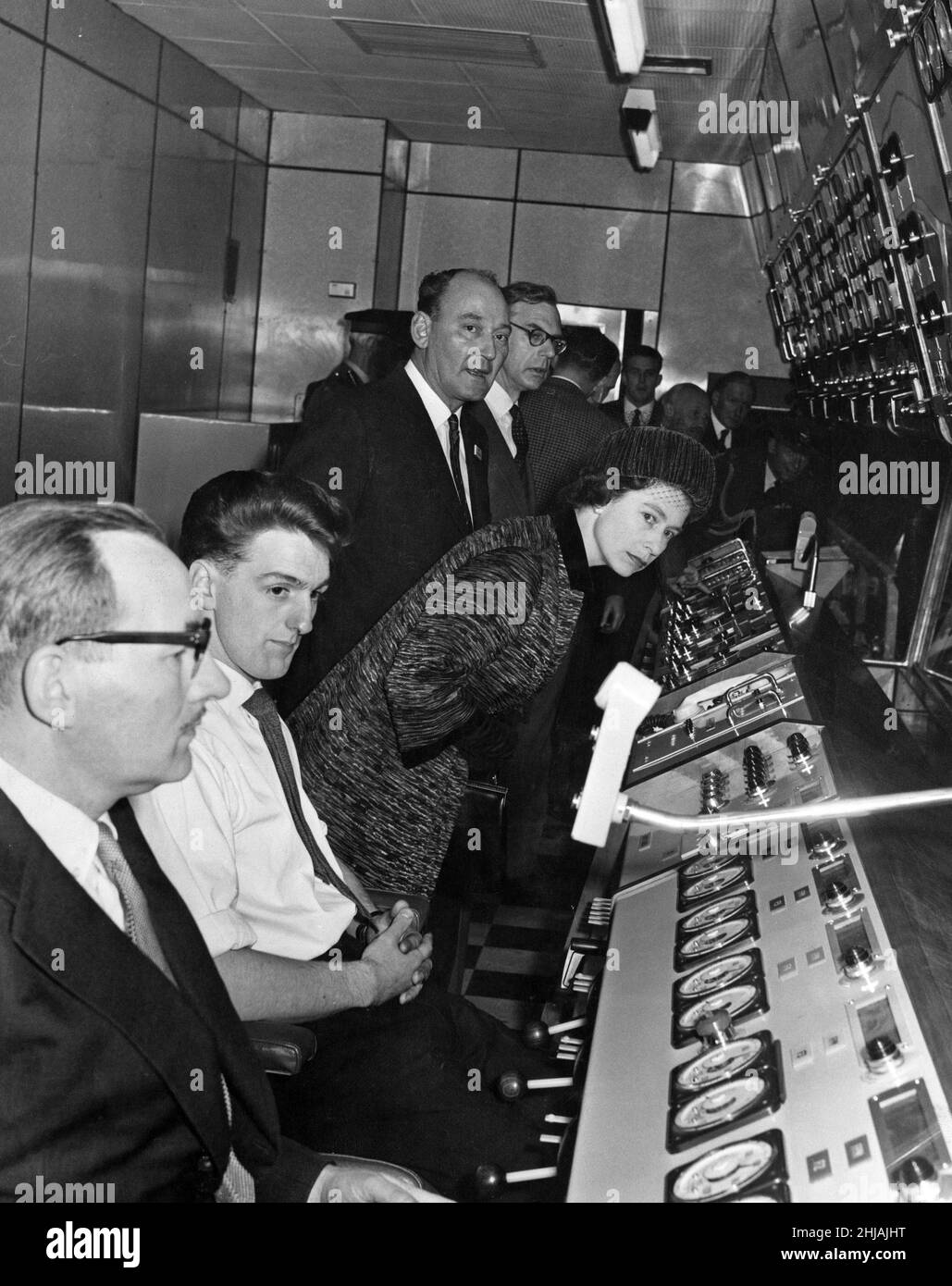 The Queen looks out from the control room at Spencer Works and watches ...