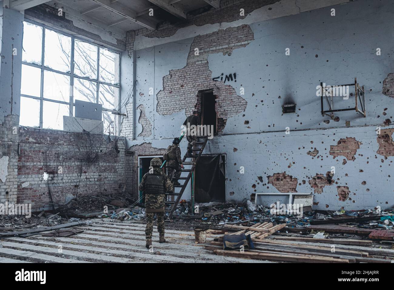 Marinka, Donetsk, Ukraine. 27th Feb, 2021. Three soldiers walking ...
