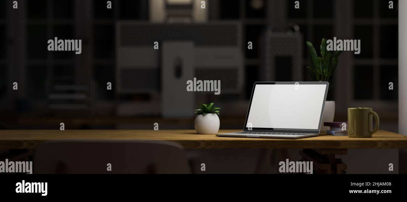 Modern dark office workstation at night concept with laptop computer ...