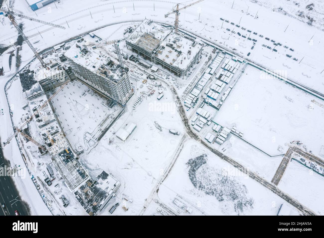 construction of high-rise apartment buildings in the winter. aerial top ...