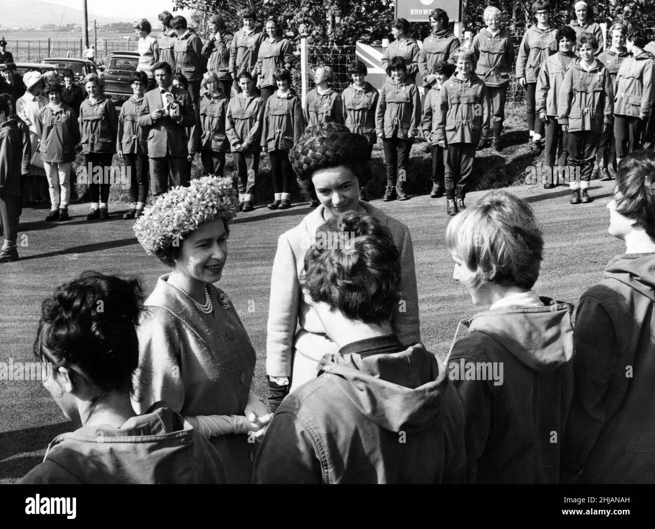 The Queen chats to girls of the Outward Bound School at Aberdovey. With ...