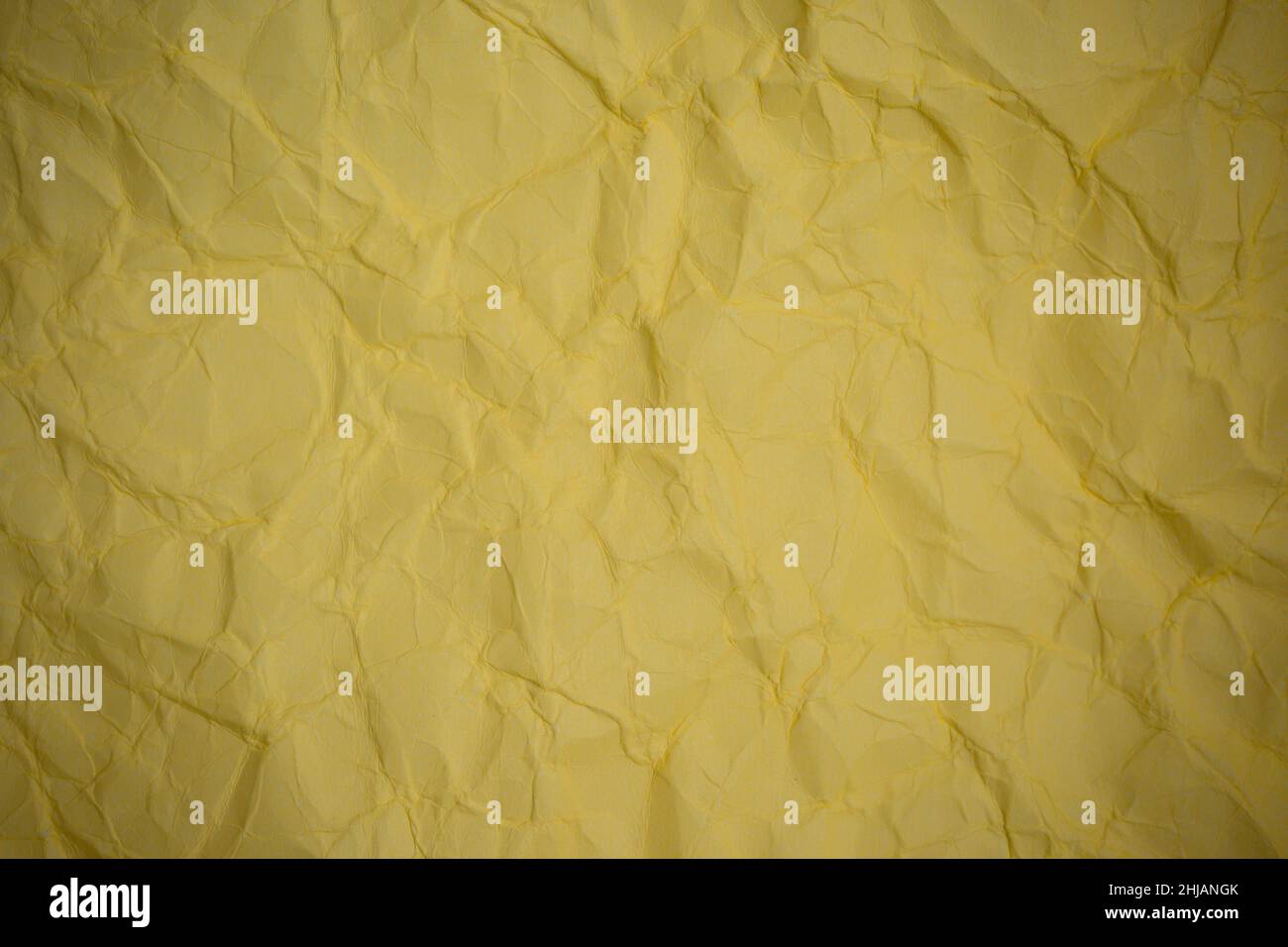 Crumpled yellow paper background Stock Photo - Alamy