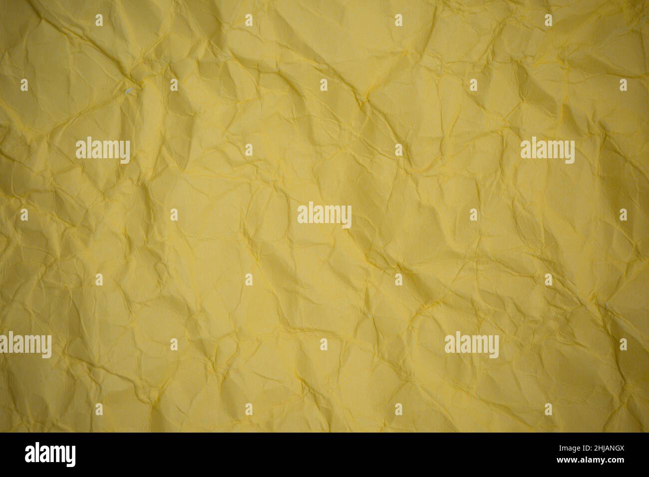 Crumpled yellow paper background Stock Photo - Alamy