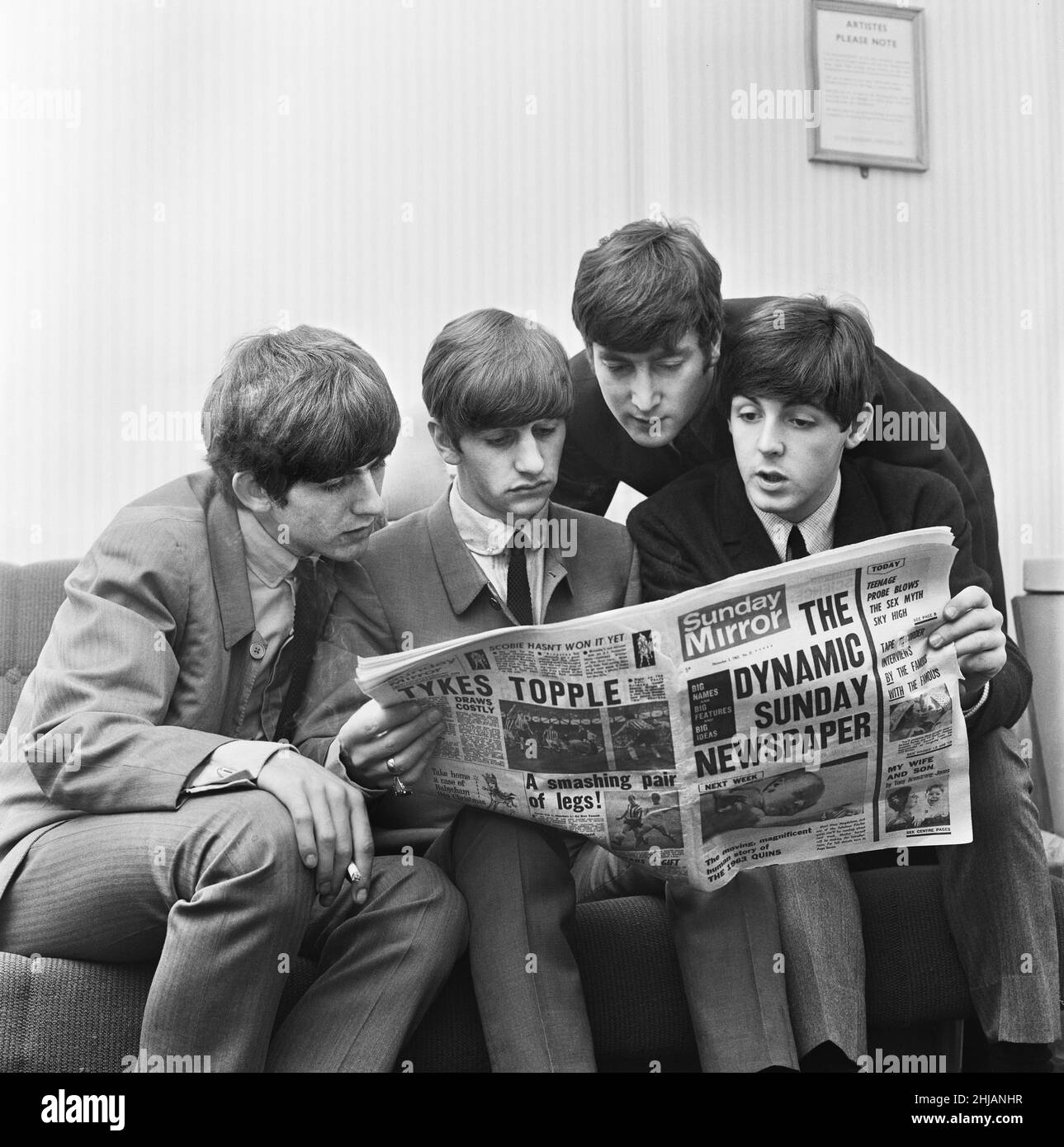 The Beatles, sit down to read the latest issue of The Sunday Mirror ...
