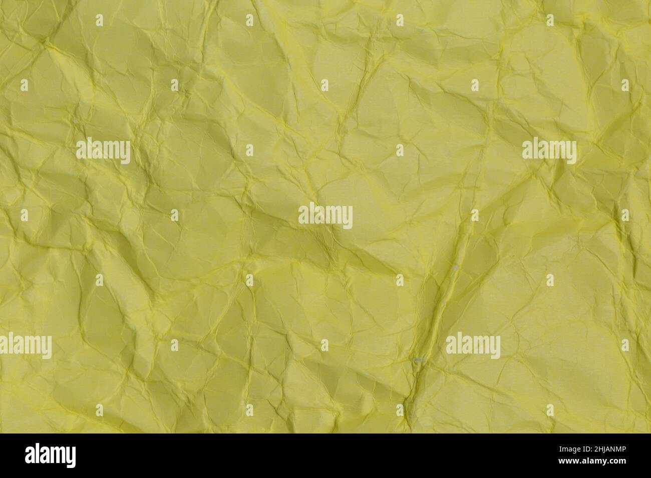 Crumpled yellow paper background Stock Photo - Alamy