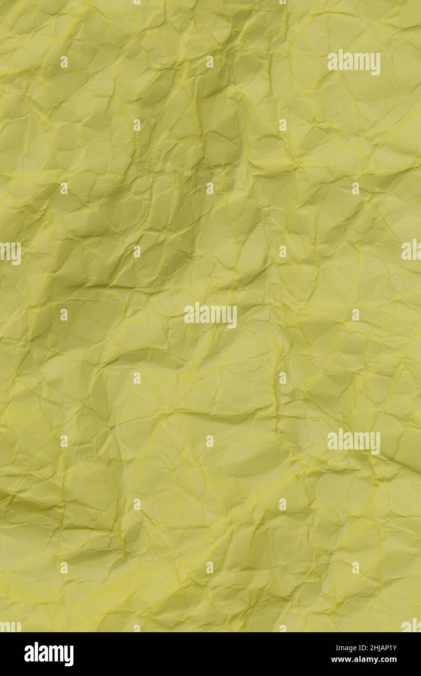 Crumpled yellow paper background Stock Photo - Alamy