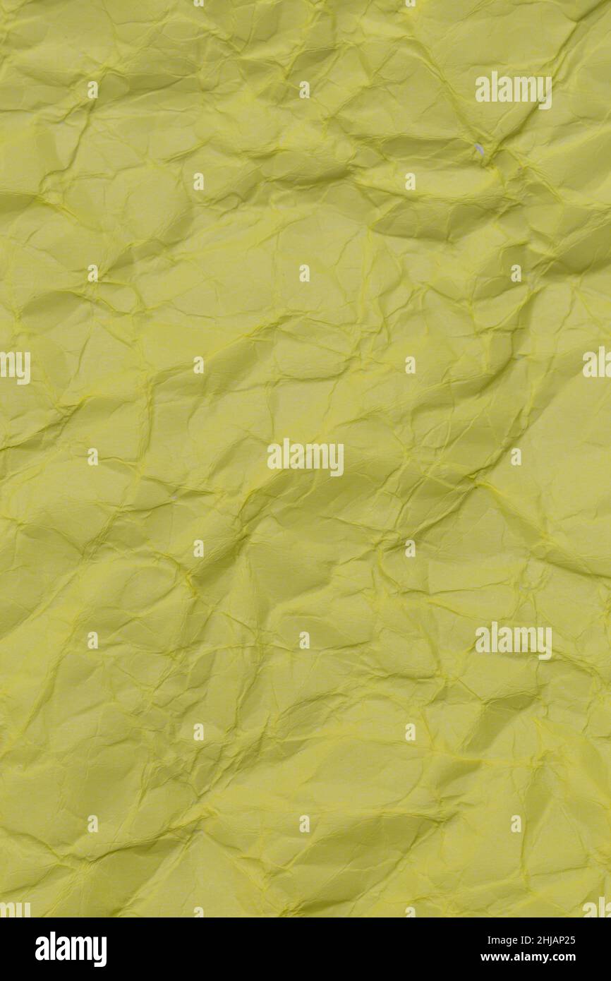 Crumpled yellow paper background Stock Photo - Alamy