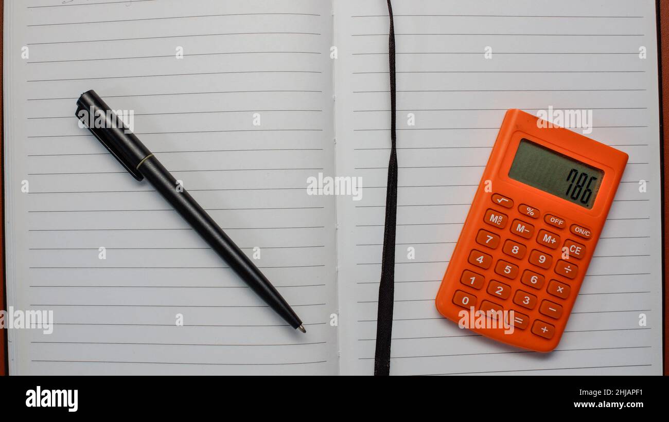 Flat layout of blank paper sheet, notebooks, calculator and pen on ...