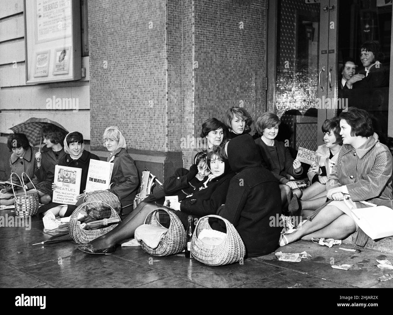 Teenagers queuing in the rain at The Majestic Ballroom, Birkenhead for ...