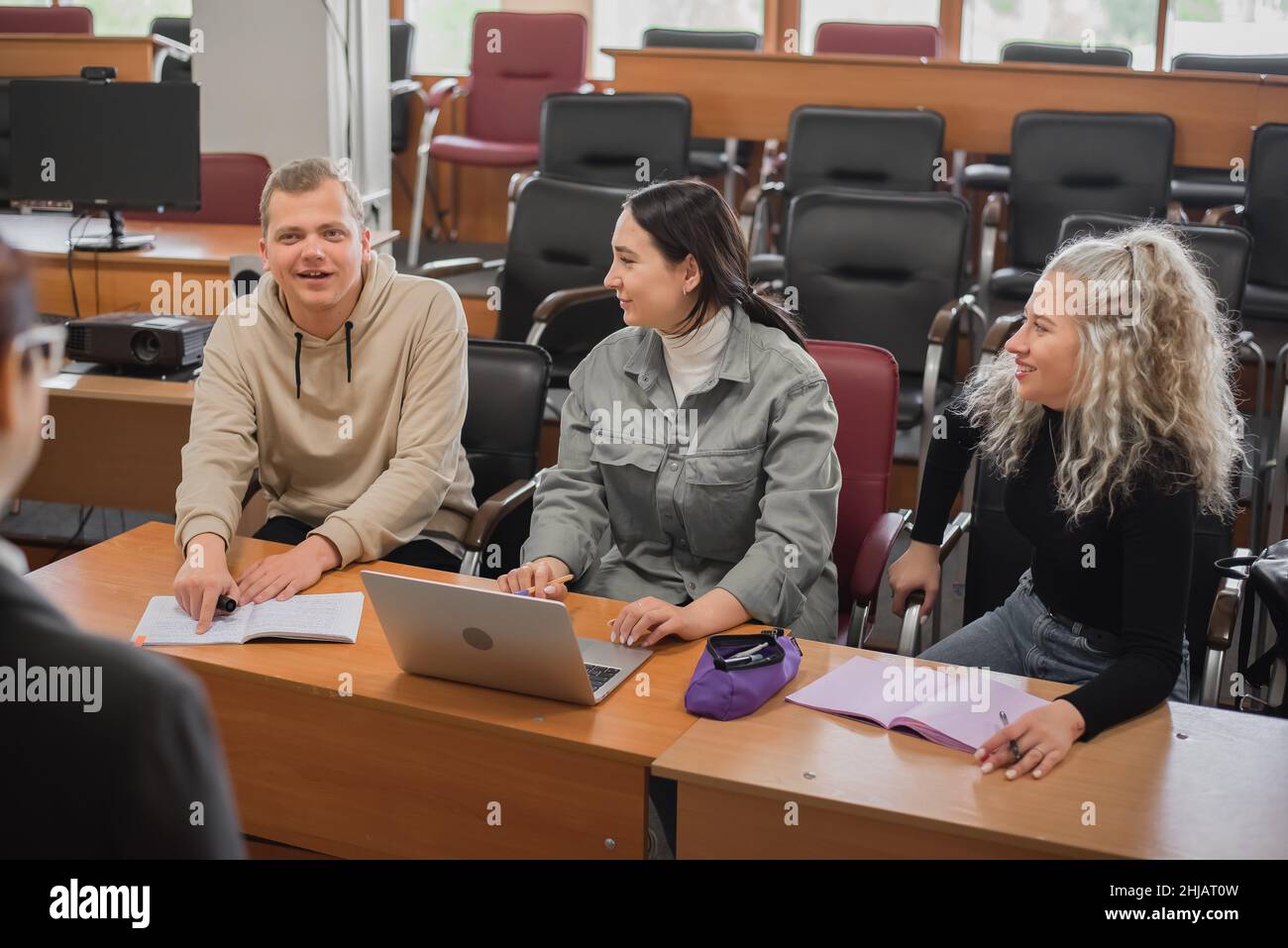 The teacher and students communicate in sign language in the classroom ...