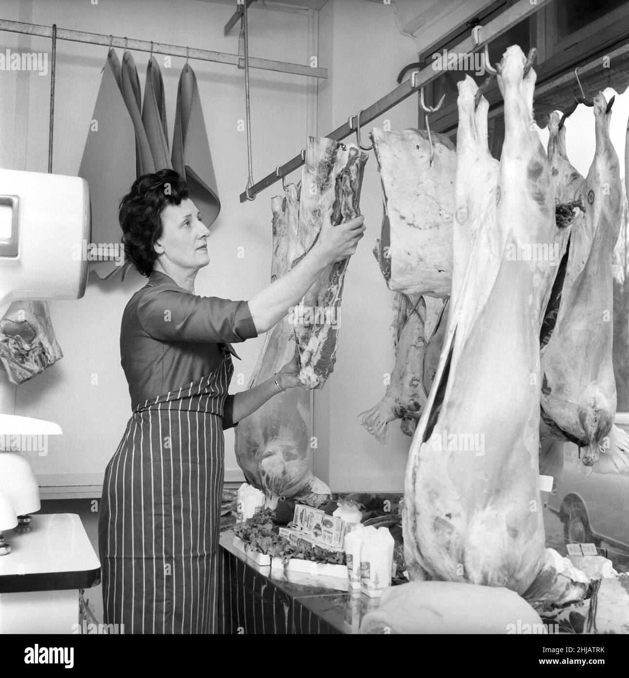 Meat hanging in butcher shop Black and White Stock Photos & Images - Alamy
