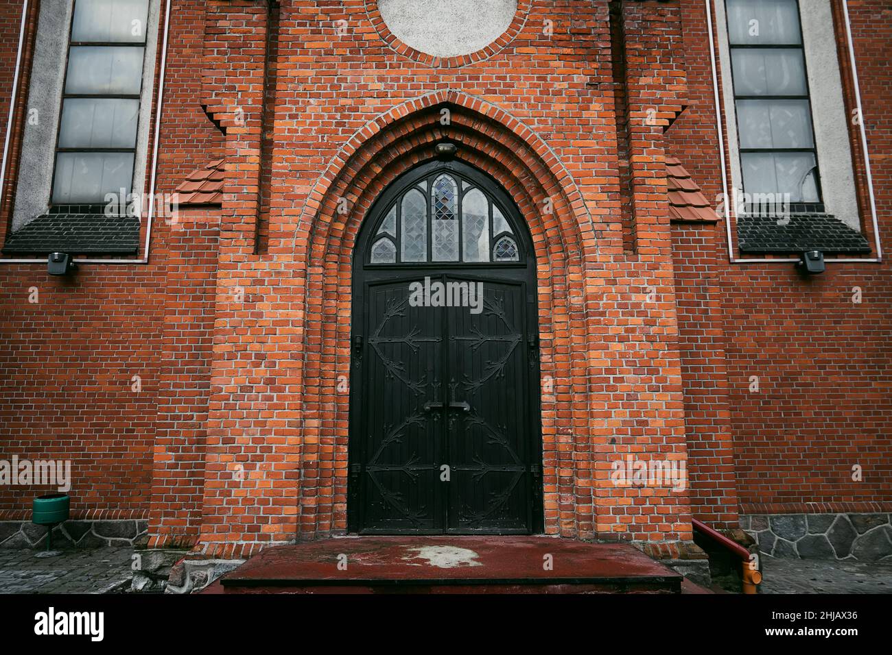 Iron door in a red brick wall. Gothic castle of Pomeranian dukes ...