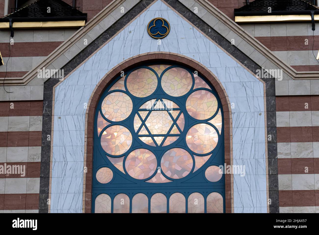 the facade of the synagogue. The star of David is in the window Stock ...