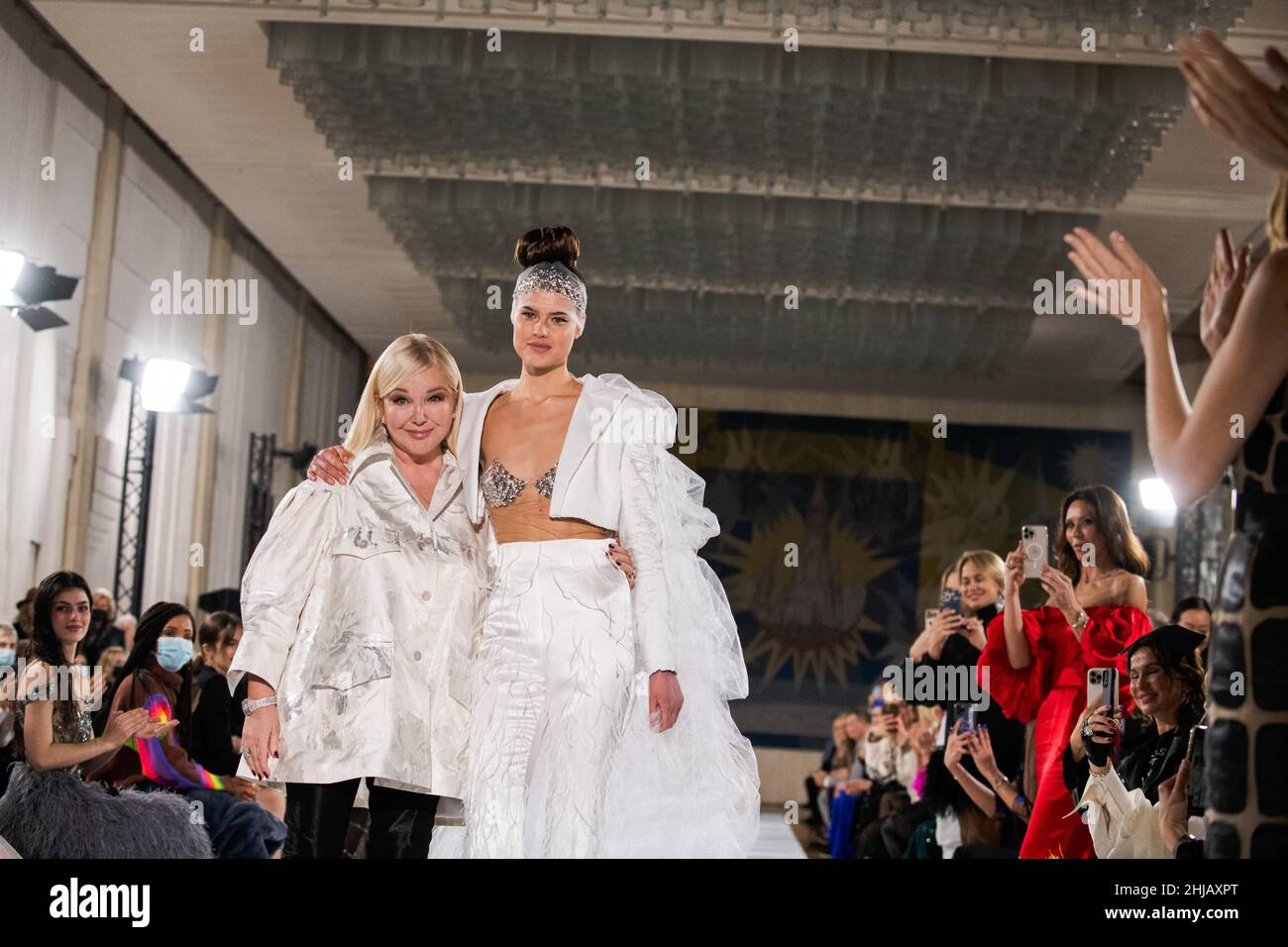 Paris, France. 27th Jan, 2022. Fashion designer Yulia Yanina and a model walk the runway during ...