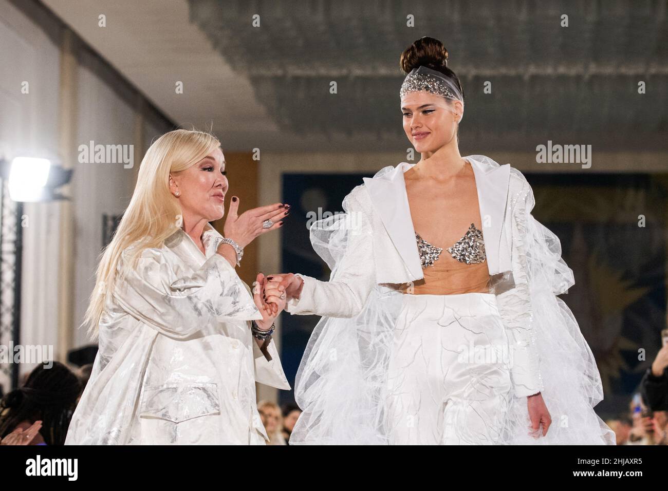 Paris, France. 27th Jan, 2022. Fashion designer Yulia Yanina and a model walk the runway during ...