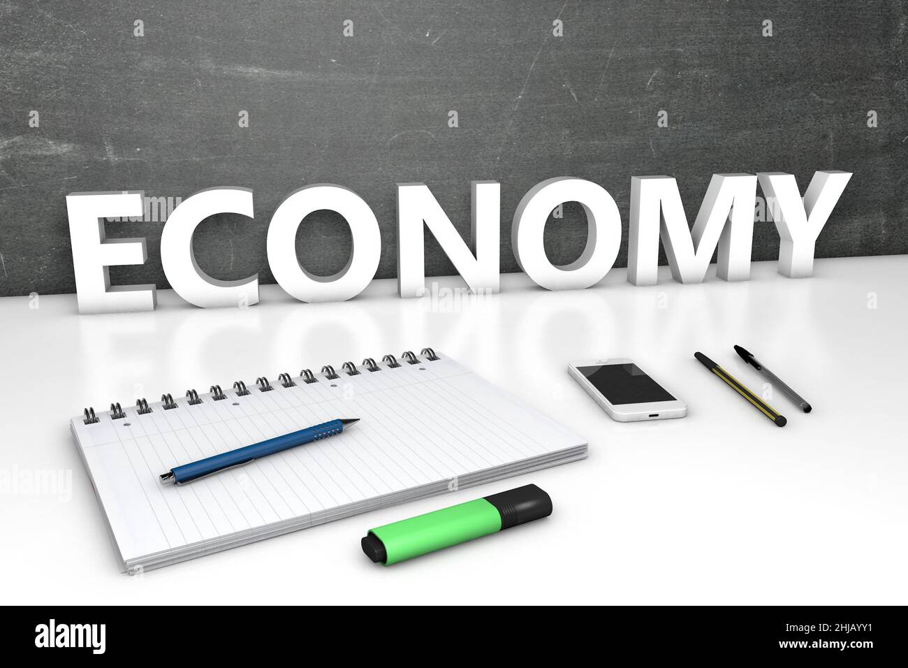Economy - text concept with chalkboard, notebook, pens and mobile phone ...