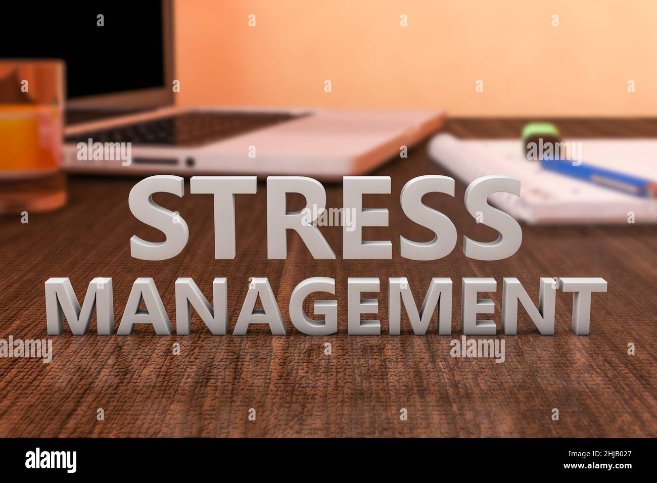 Stress Management - letters on wooden desk with laptop computer and a ...